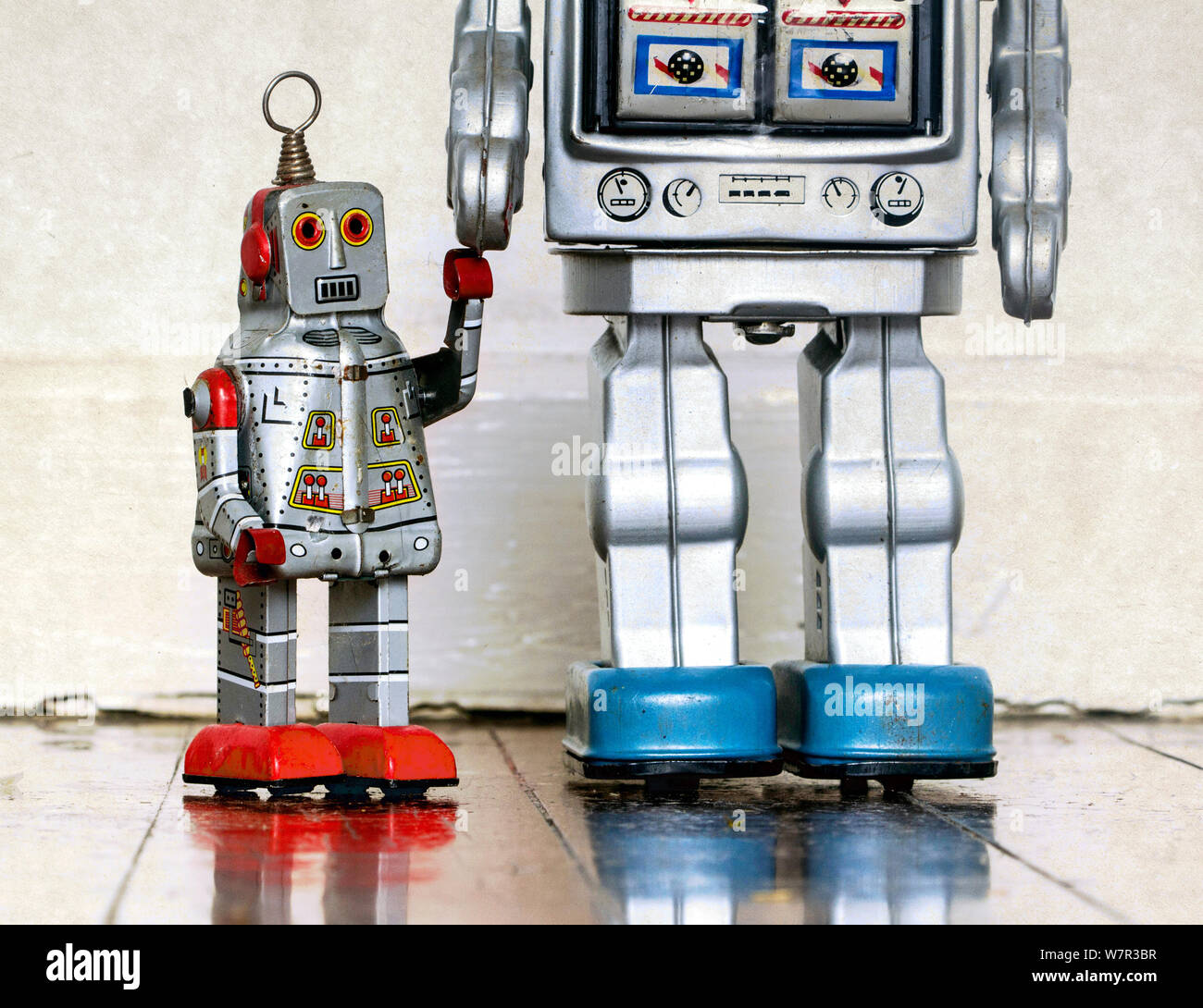 father and son robot toys on wooden floor Stock Photo - Alamy