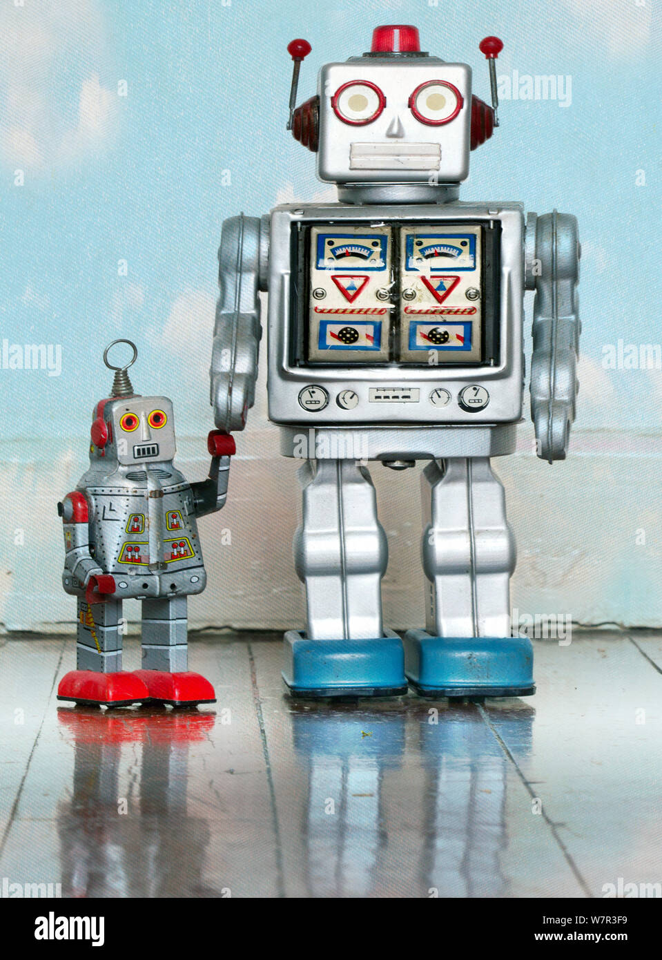 father and son robot toys on wooden floor and blue sky Stock Photo - Alamy