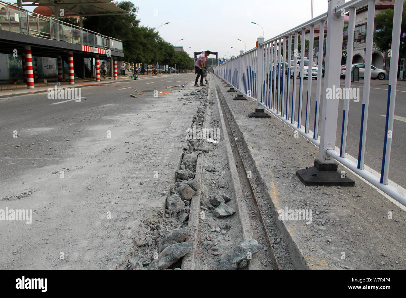 A Chinese worker demolishes the special tracks for the test drive of ...