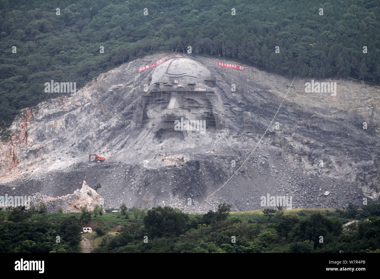 A sculpture of Fuxi, a culture hero in Chinese legends, is being carved ...
