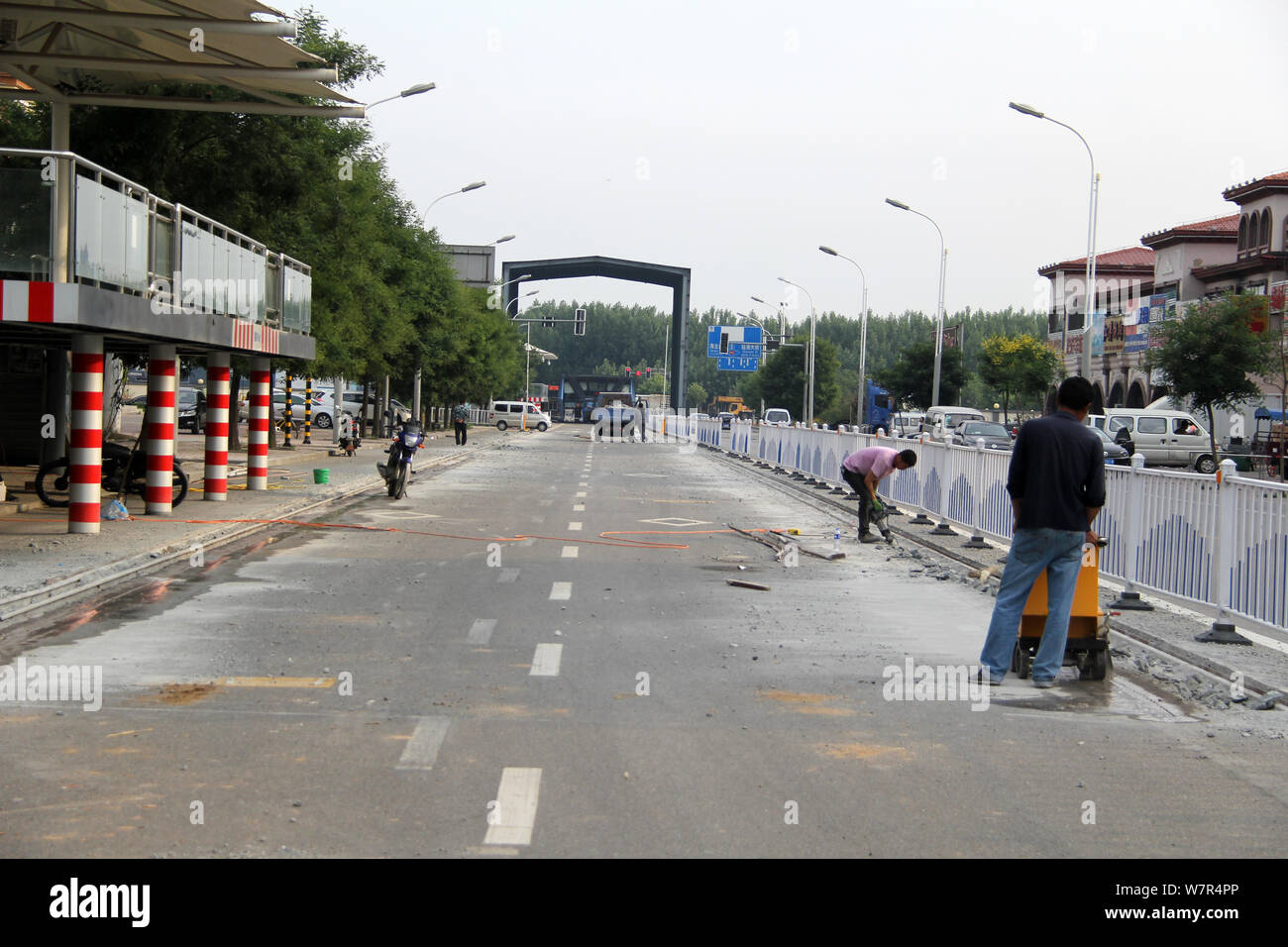 A Chinese worker demolishes the special tracks for the test drive of ...