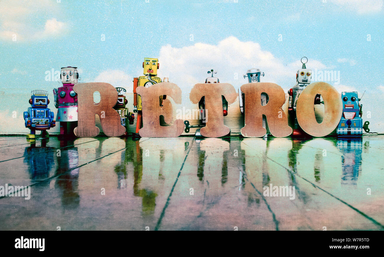 the word RETRO tit wooden letters with retro robot toys on an old ...