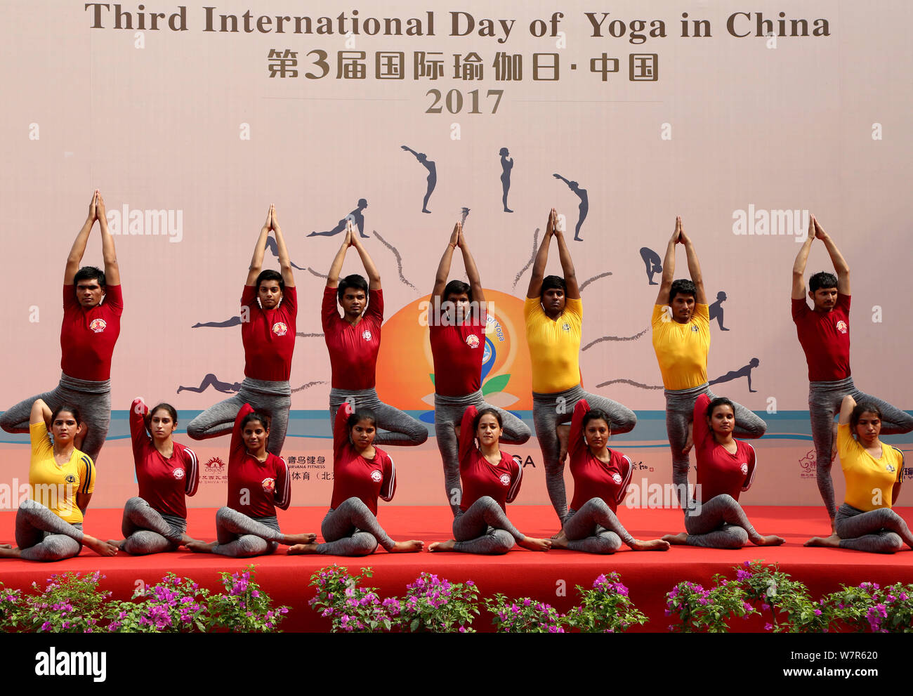 Chinese enthusiasts perform yoga to mark the mark the International ...