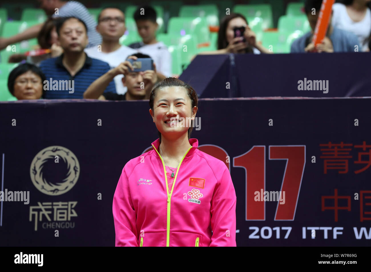 Winner Ding Ning of China poses on the podium after the final match of women's singles during ...