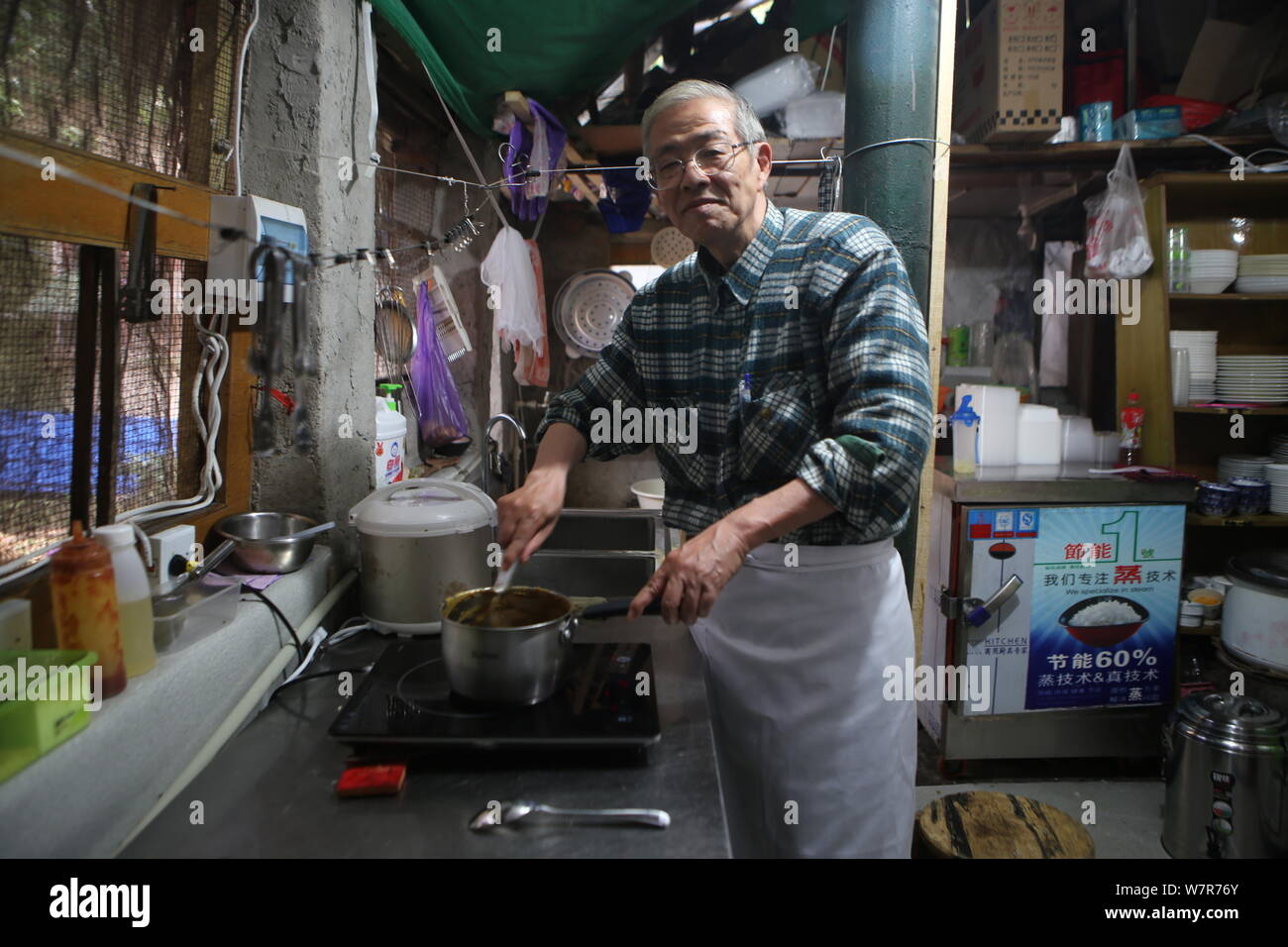 70-year-old Japanese man Koji Shimada makes curry food at his Japanese-style curry restaurant in ...