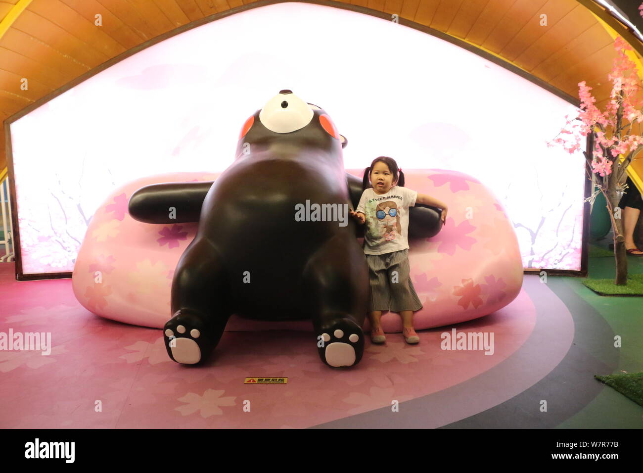 A visitor poses during an exhibition featuring Kumamoto Prefecture's ...