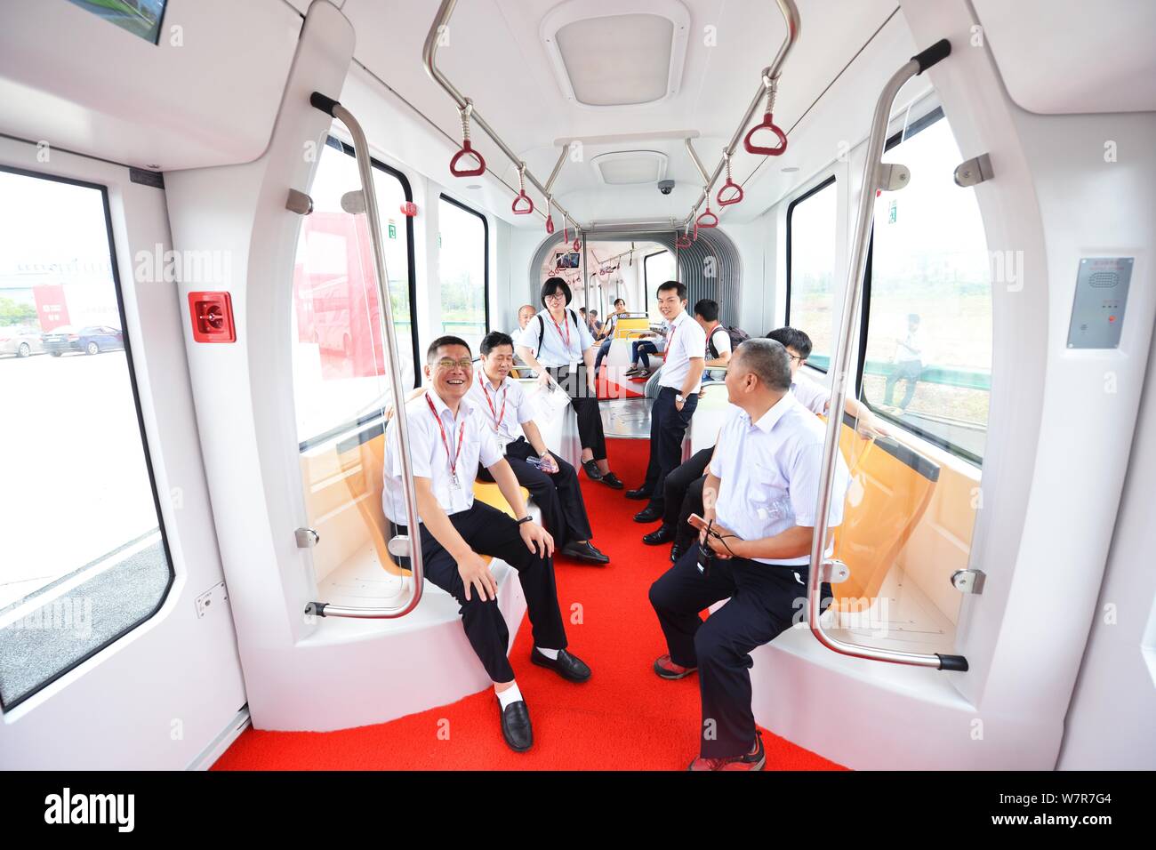 Visitors take the world's first railless train, developed by the CRRC ...