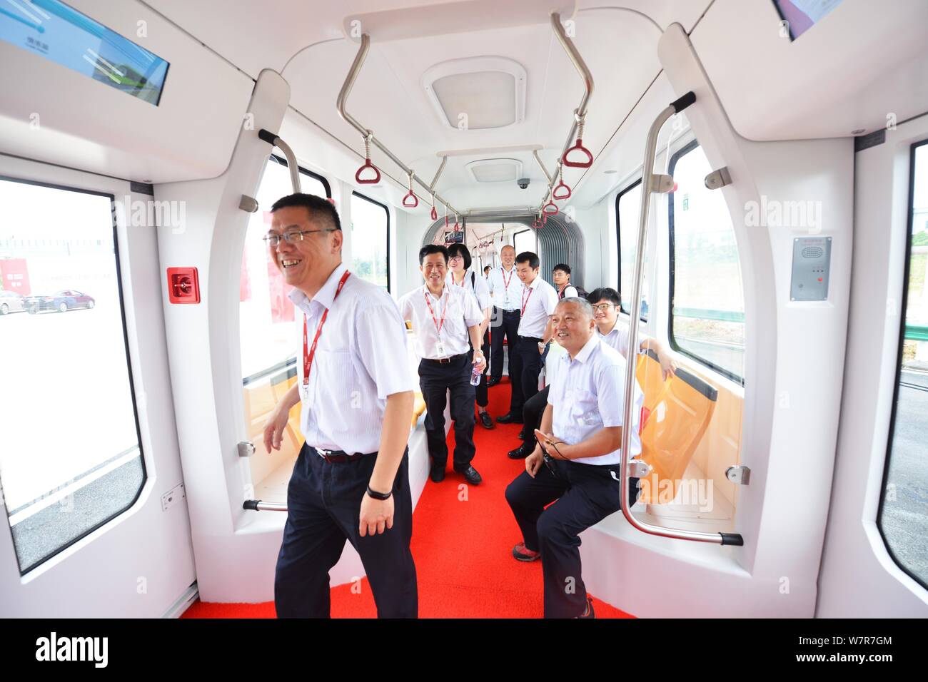 Visitors take the world's first railless train, developed by the CRRC ...