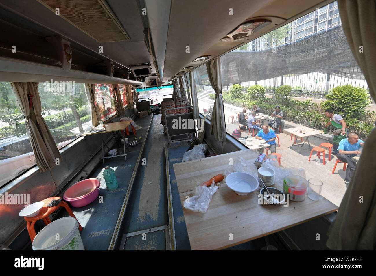 Interior view of the bus restaurant run by Chinese worker Wan in ...