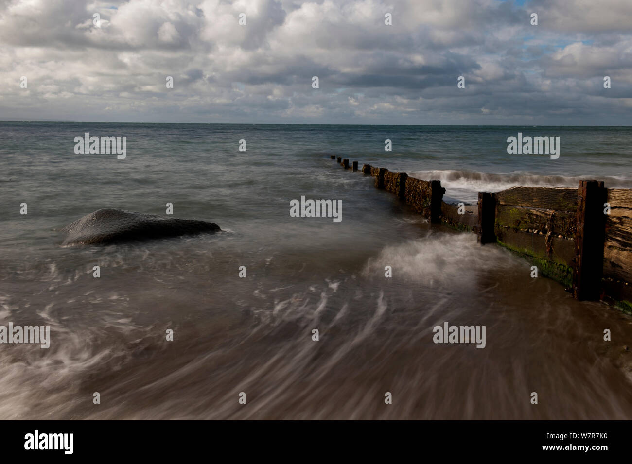 Sea water turbulence around a broken groyne, Criccieth, North Wales ...