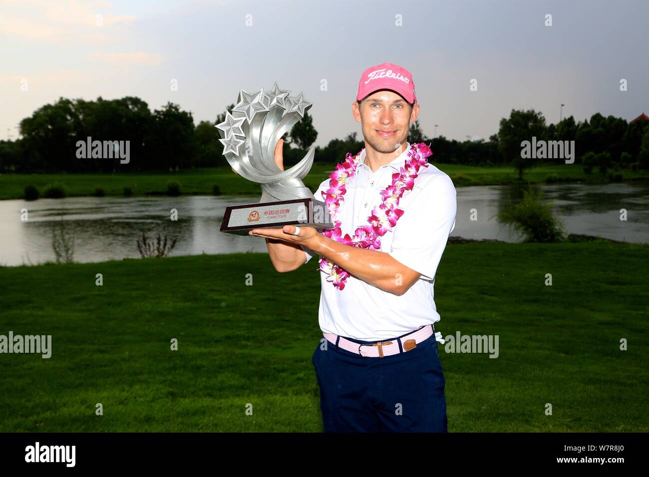 Bryden Macpherson of Australia poses with his trophy after winning the ...