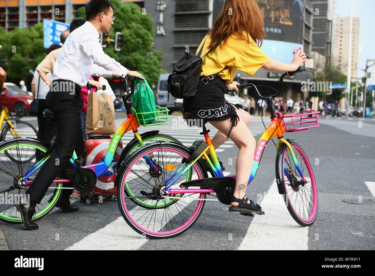 Local residents ride seven-colored shared bicycles of Chinese bike ...