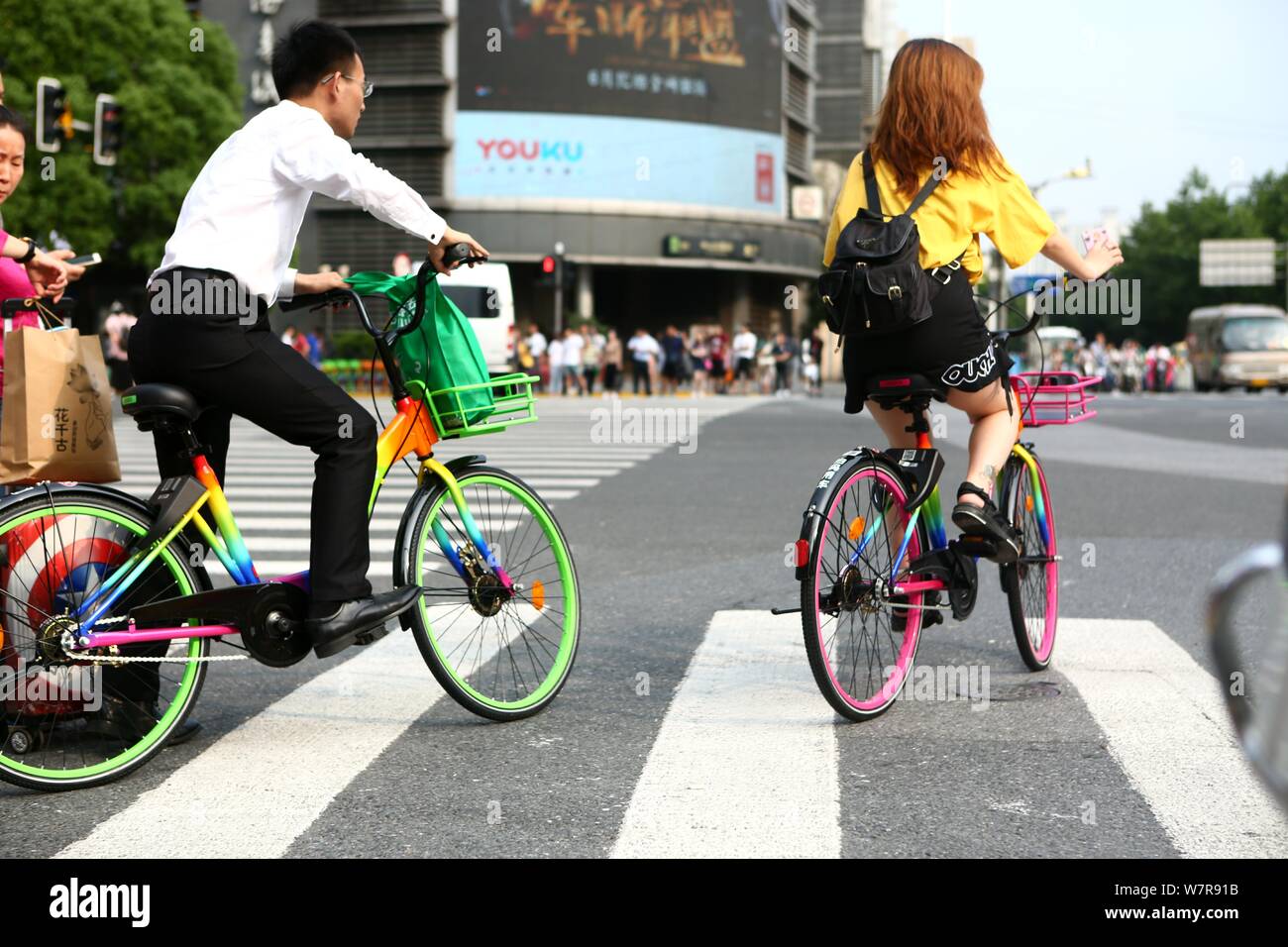 Local residents ride seven-colored shared bicycles of Chinese bike ...