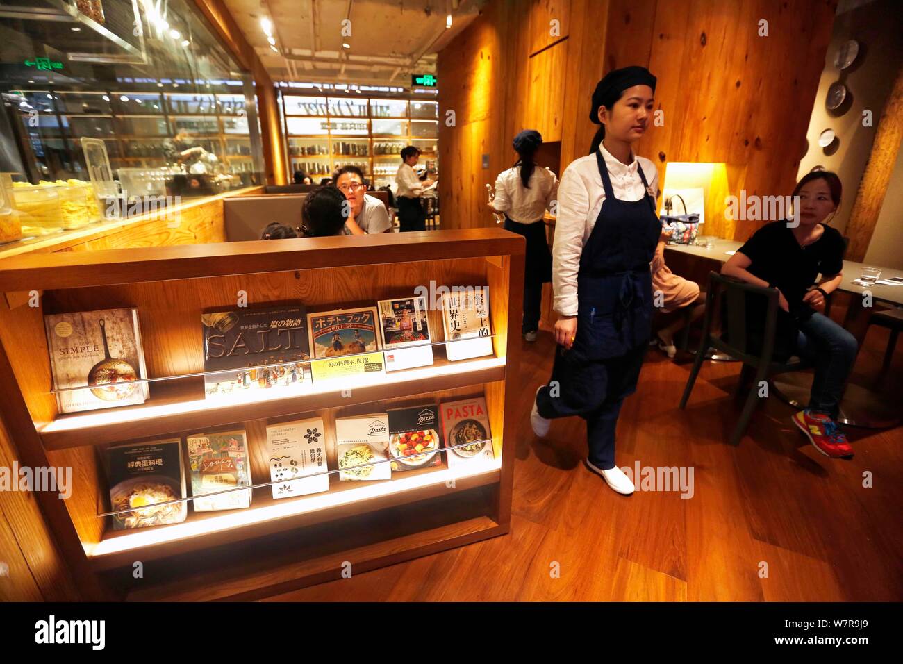 Customers are seen at the world's first MUJI Diner on Huaihai Road in ...