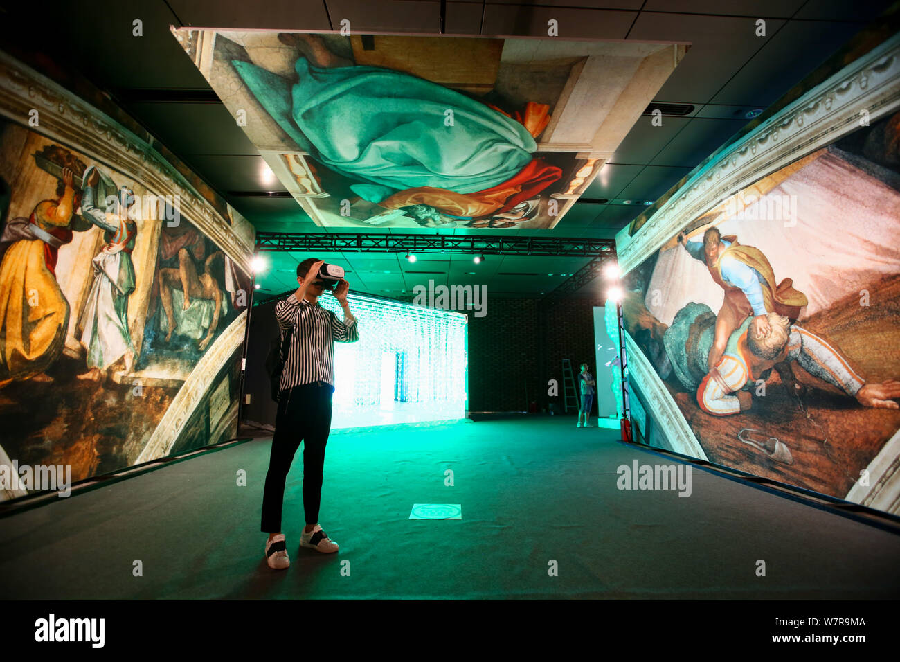 A visitor tries out an AR (Augmented Reality) Glass to expreience ...