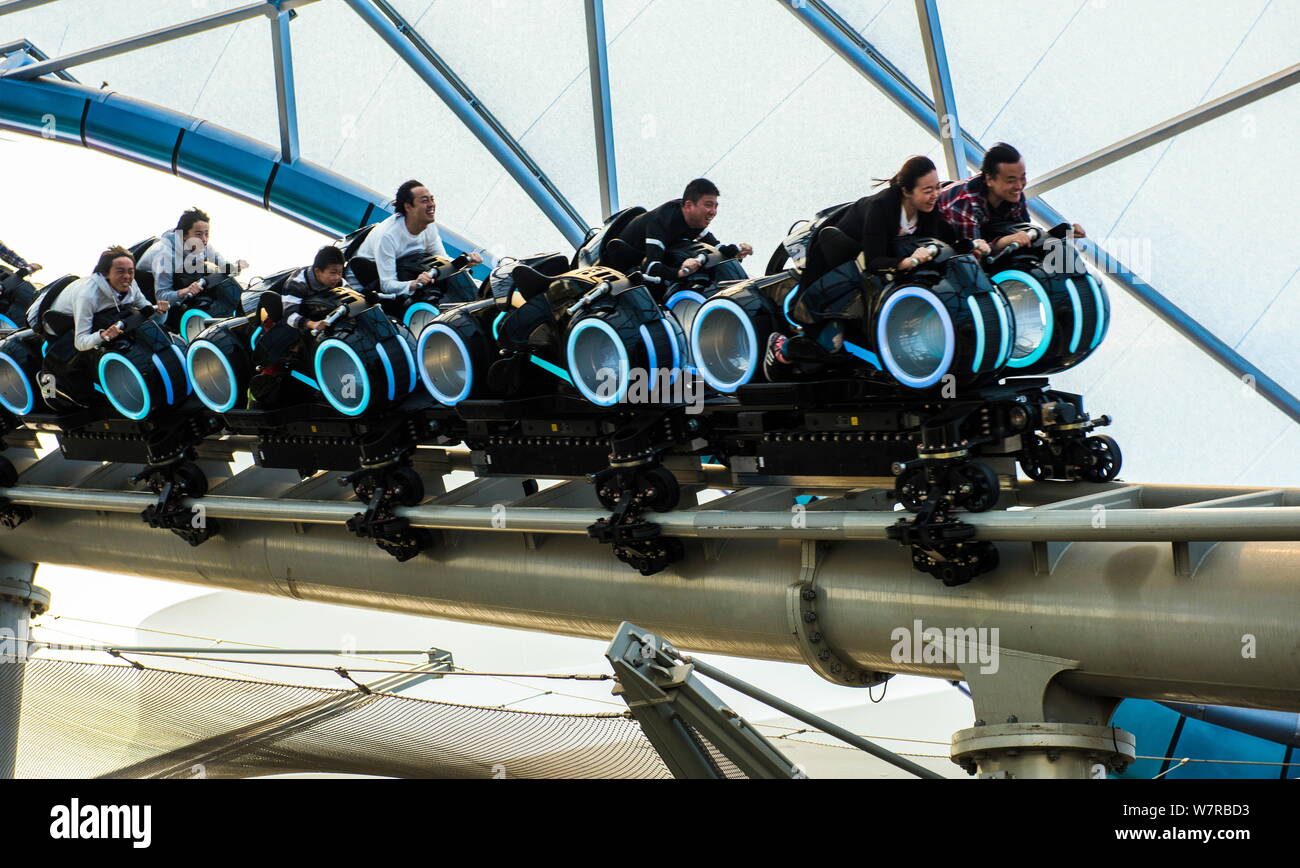 Tourists have fun on the roller coaster at Tomorrowland in the Shanghai Disneyland at the ...