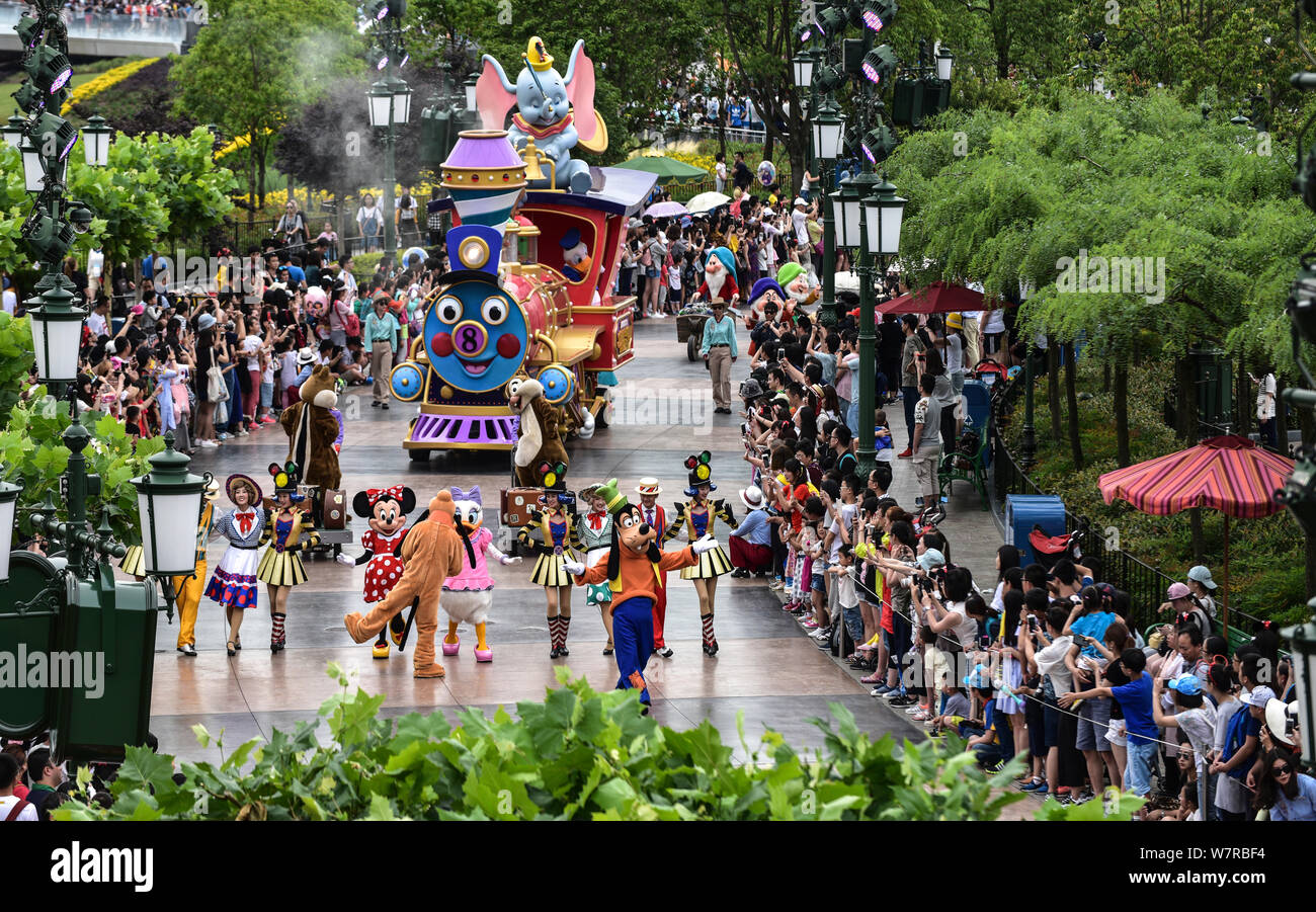 Entertainers perform during a parade at the first anniversary ...