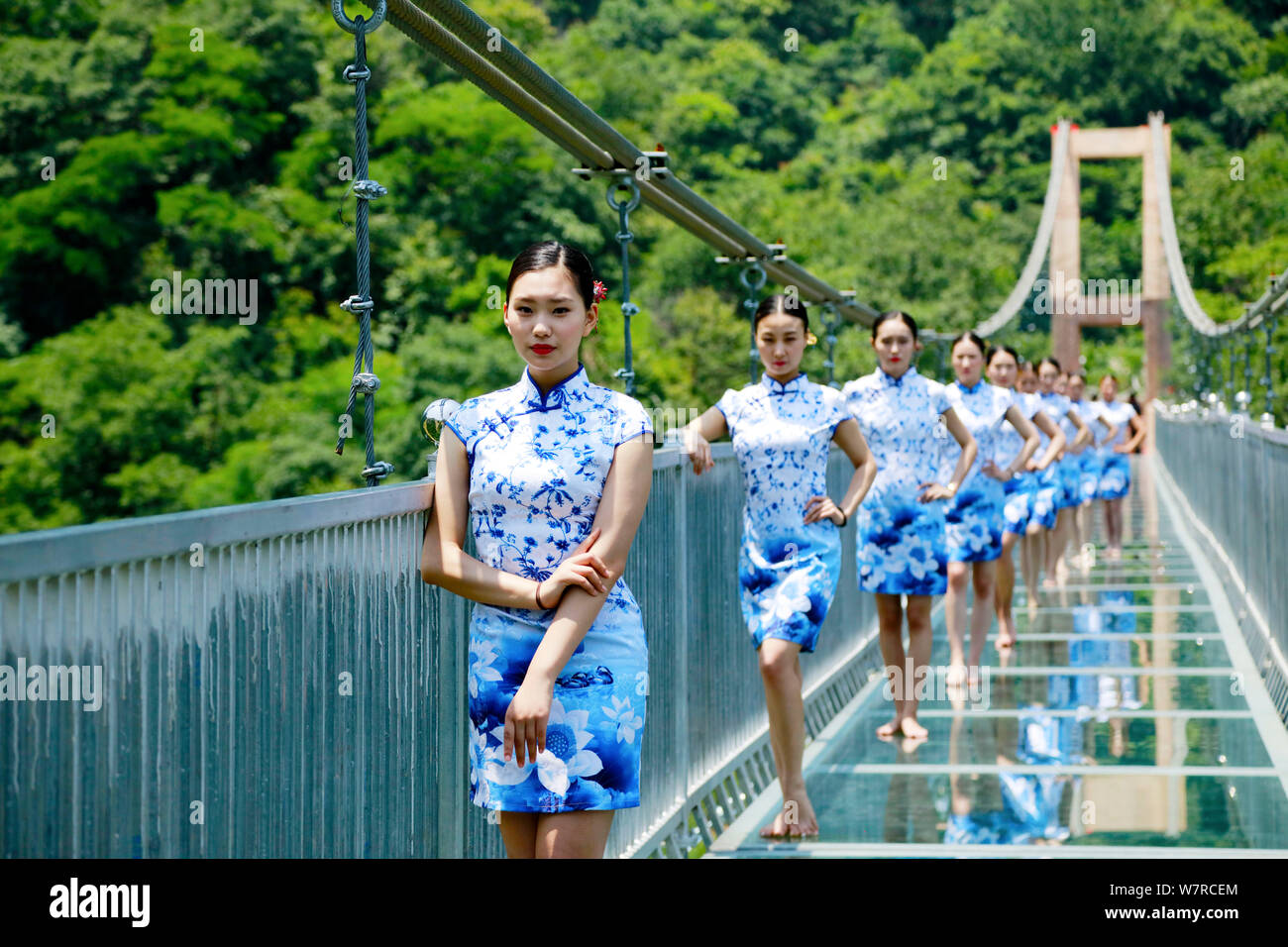 Female graduates dressed in cheongsam, also known as qipao in Chinese ...