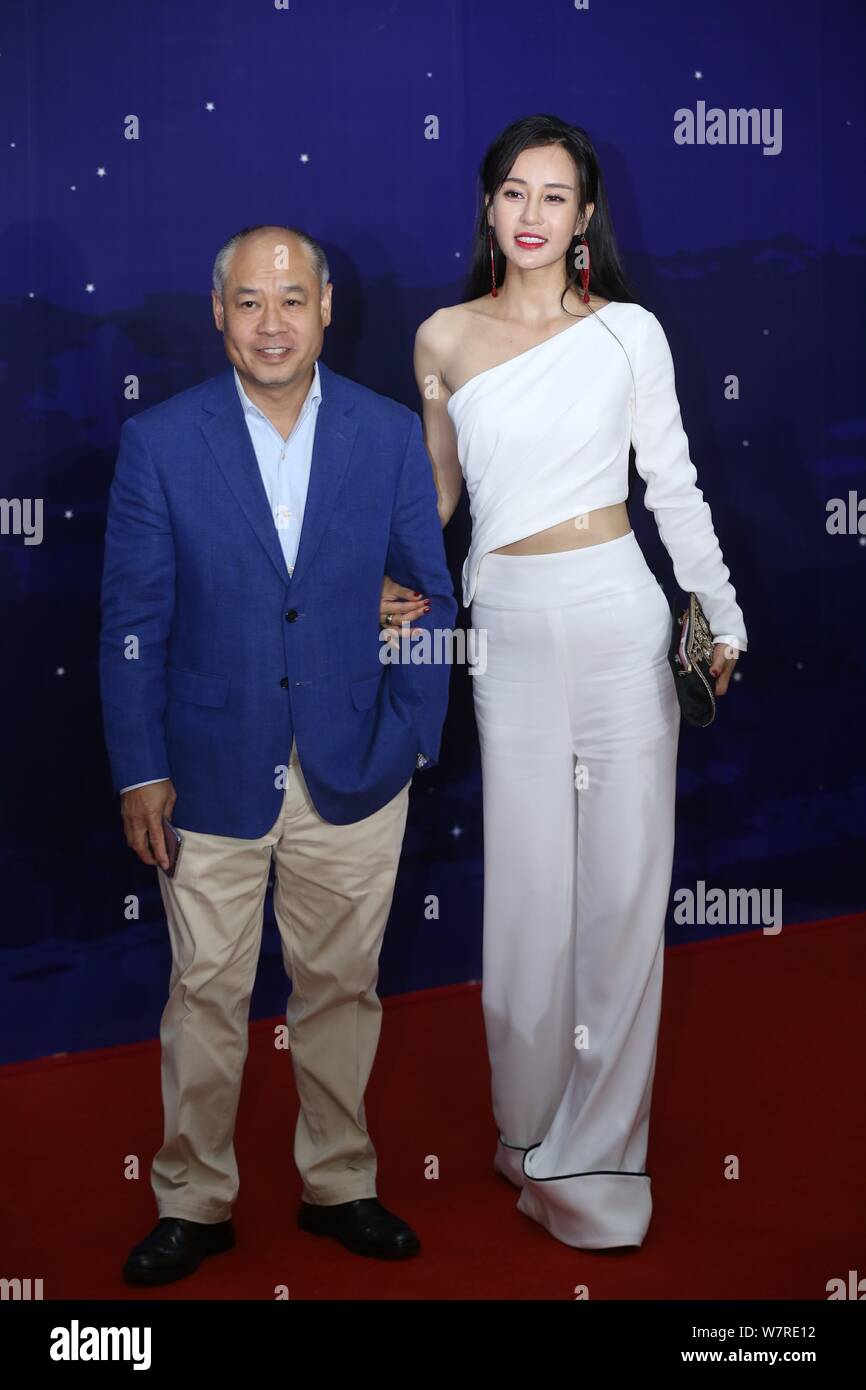 Former Chinese Olympic gymnastics champion Li Ning, left, chairman of ...