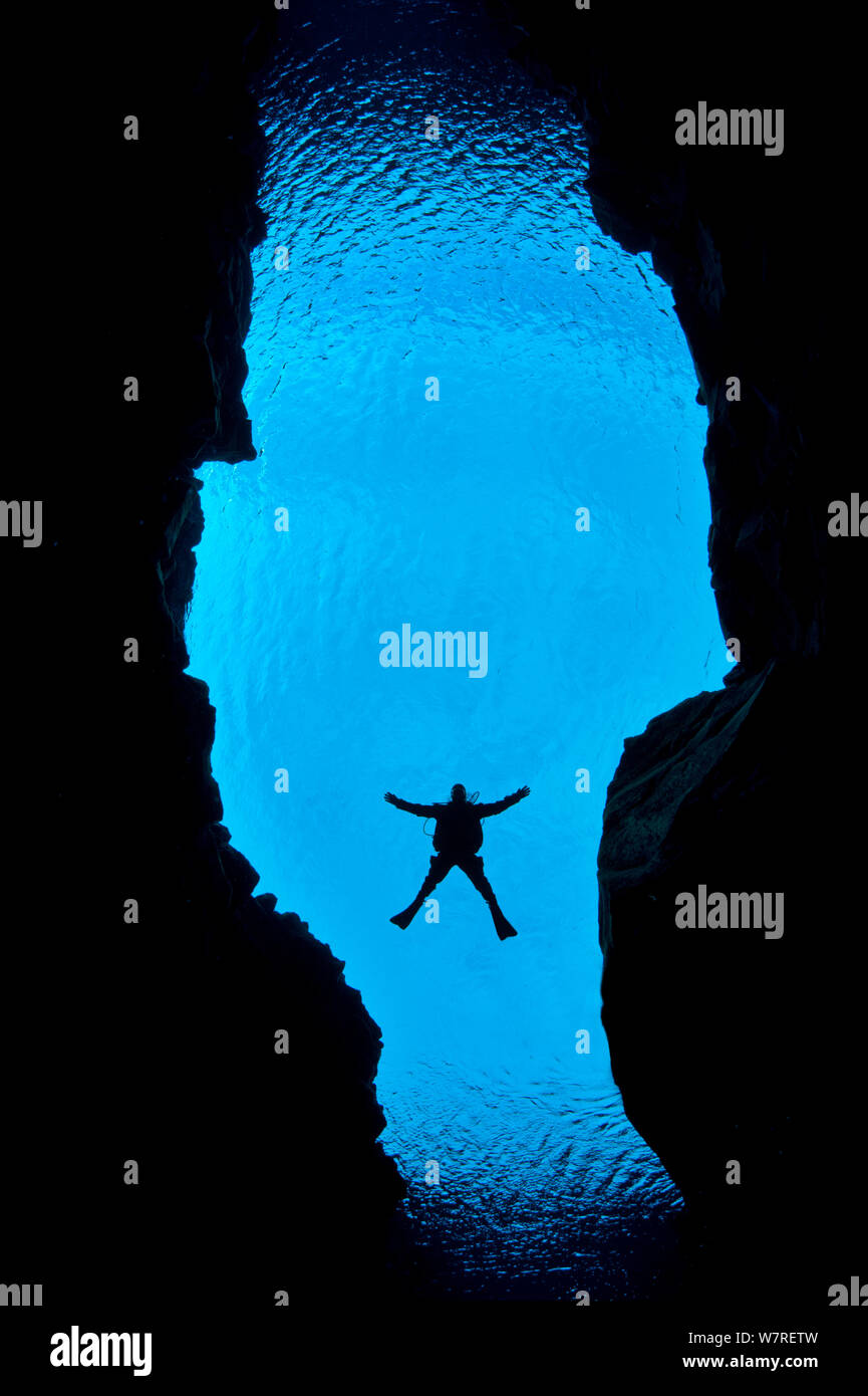 Swimming through rift valley iceland hi-res stock photography and ...