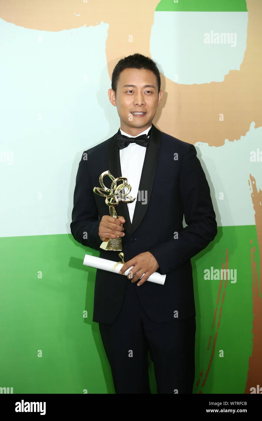 Chinese actor Zhang Yi pose with his trophy after winning the Best ...