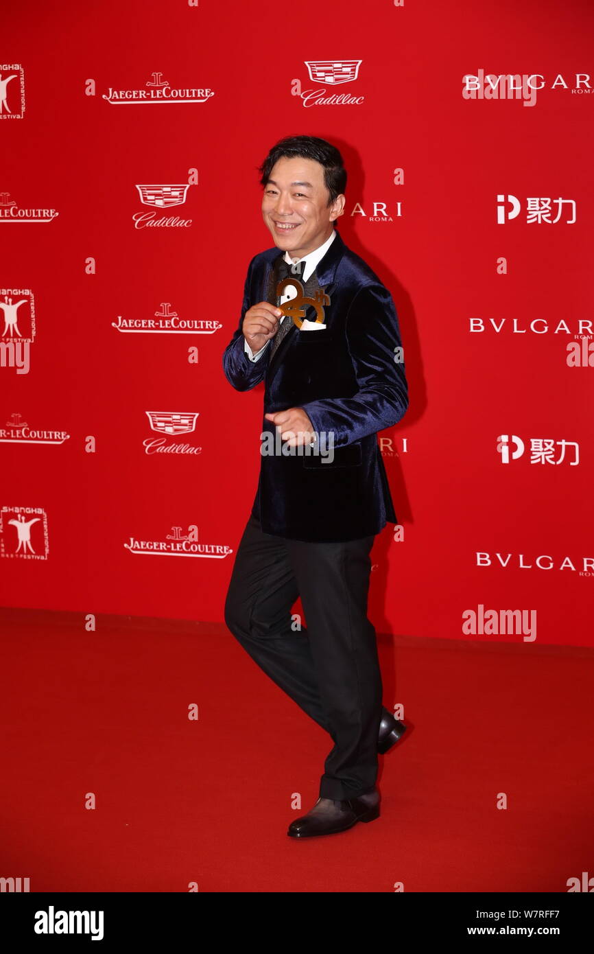 Chinese actor Huang Bo arrives on the red carpet for the closing ...