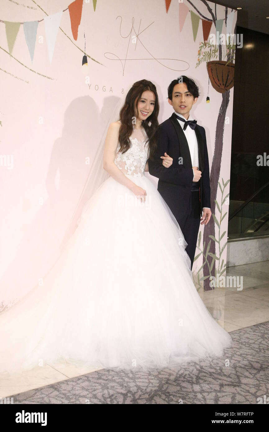 Taiwanese singers Yoga Lin, right, and Kiki Ting attend their wedding ...