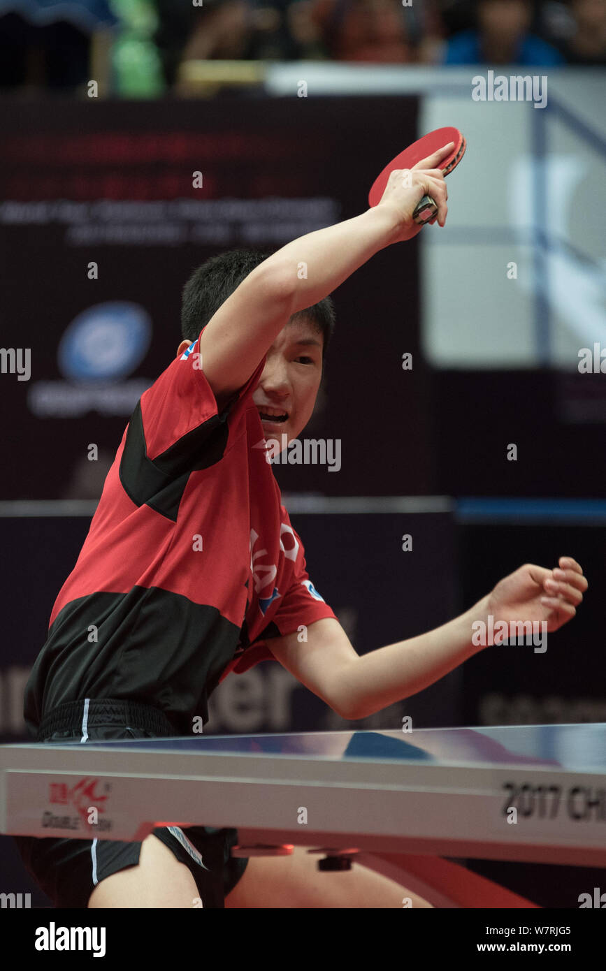 Harimoto Tomokazu of Japan returns a shot to Timo Boll of Germany in ...