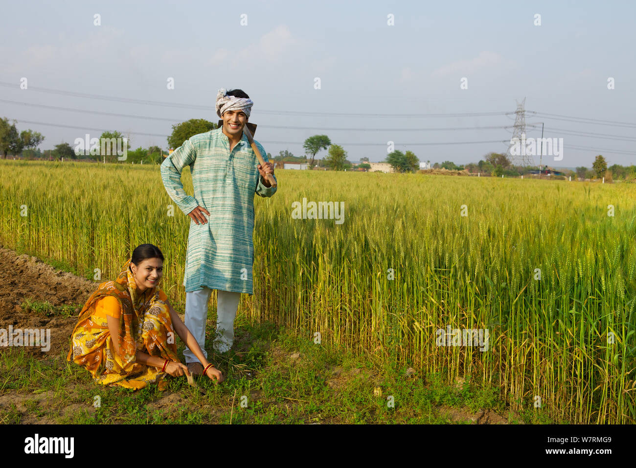 Farmer working in an agricultural field Stock Photo - Alamy
