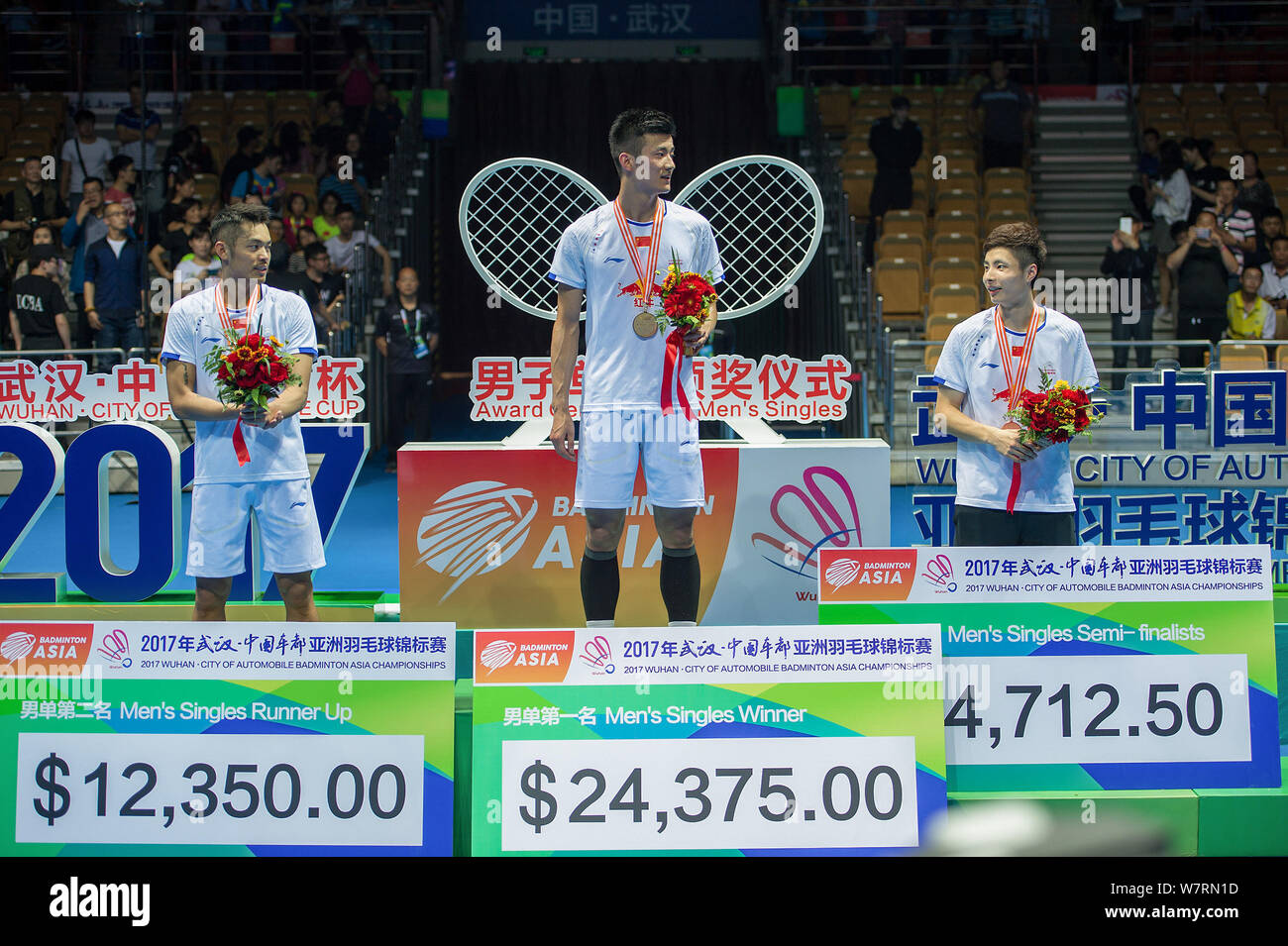 (From left) First runner-up Lin Dan of China, winner Chen Long of China and second runner-up Shi ...