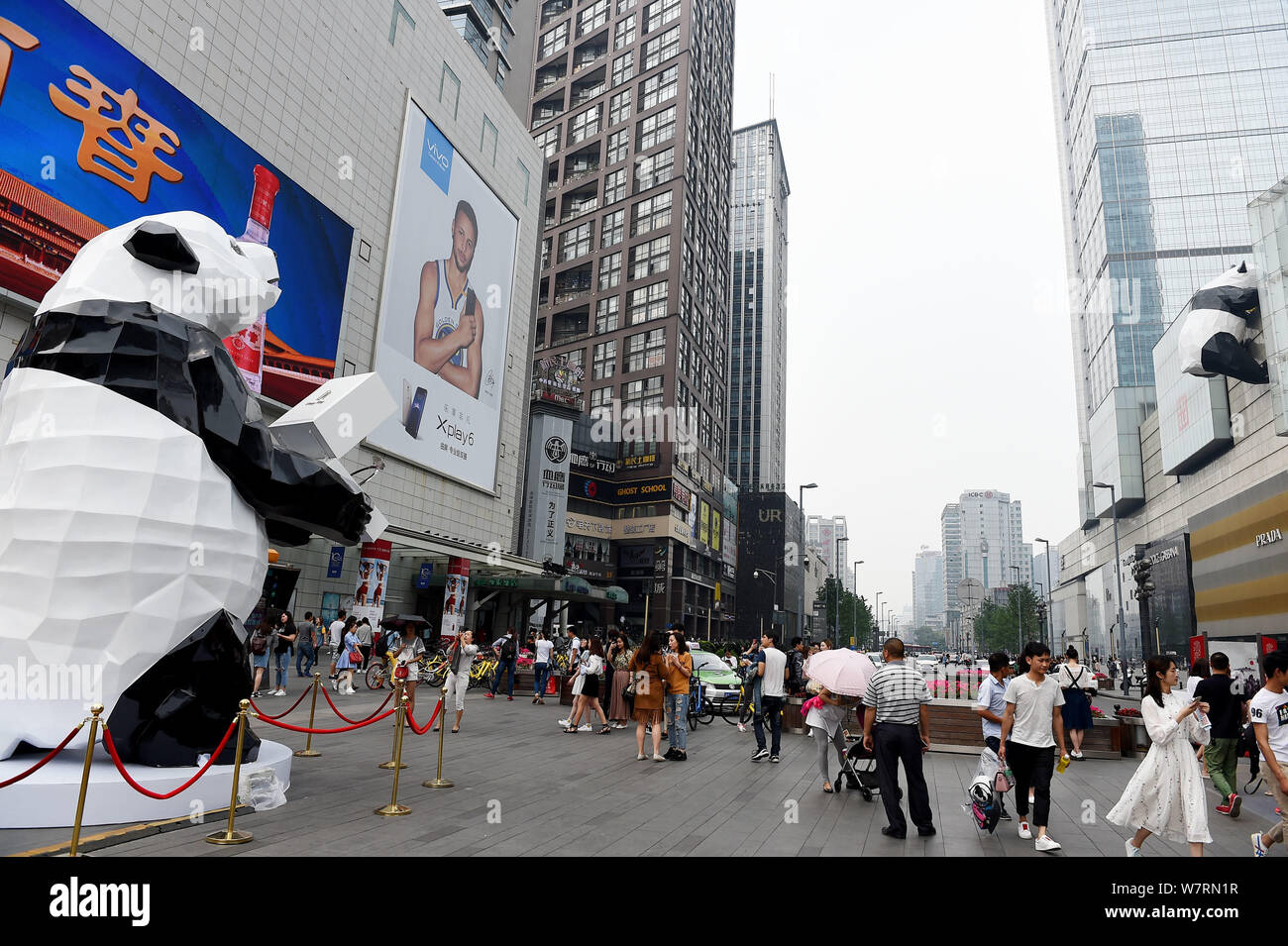 A giant panda sculpture holding a diamond ring kneels to make a ...