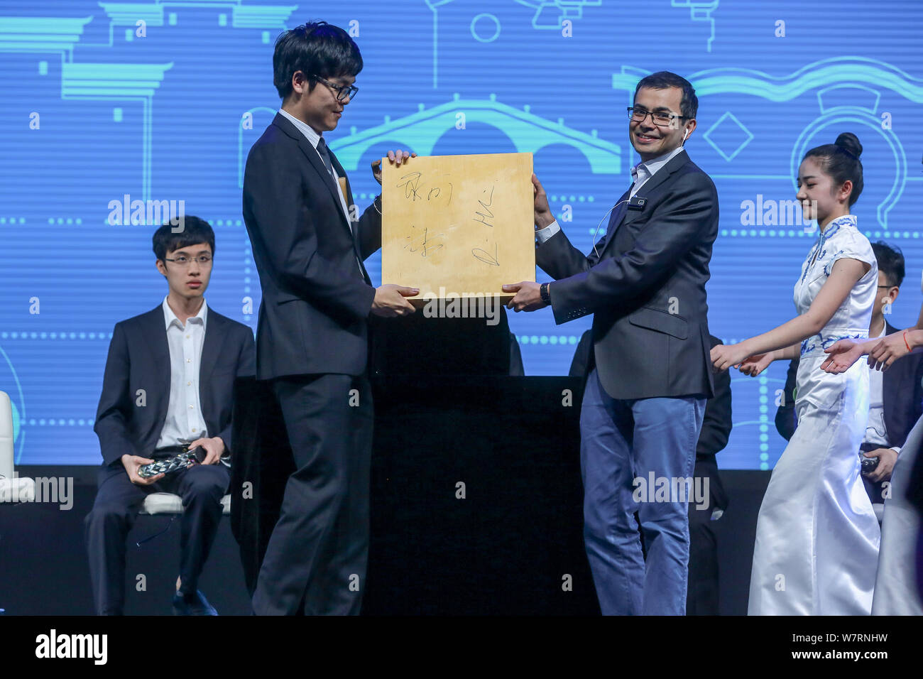 Chinese Go players Ke Jie, second left, and Demis Hassabis, second ...