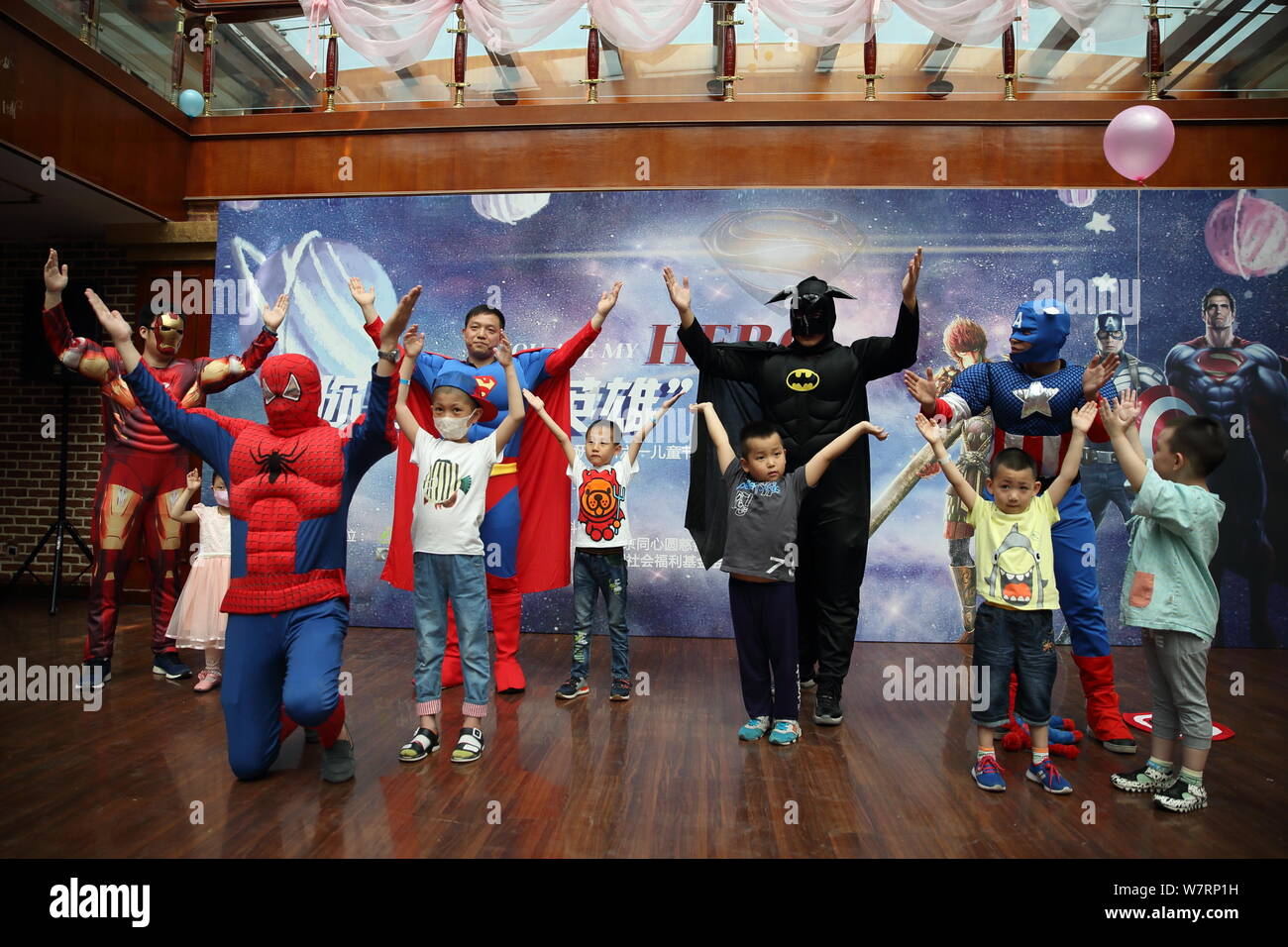 Chinese staff members dressed like Iron Man, Spiderman, Superman ...