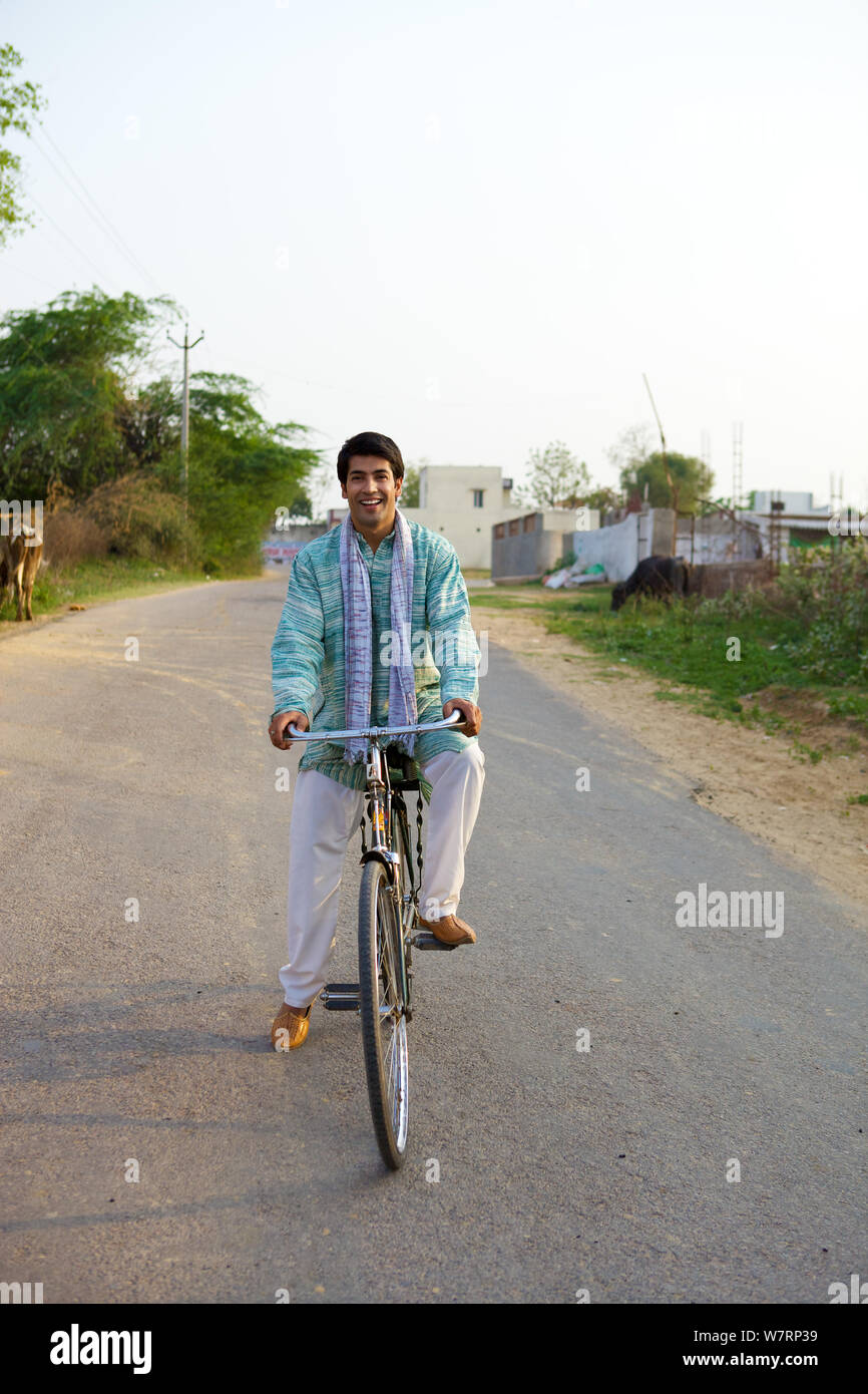 Indian man riding bicycle hi-res stock photography and images - Alamy