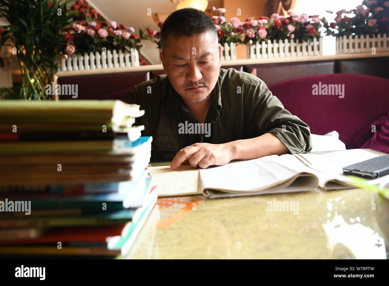 50-year-old Chinese man Liang Shi is pictured as he prepares for the ...