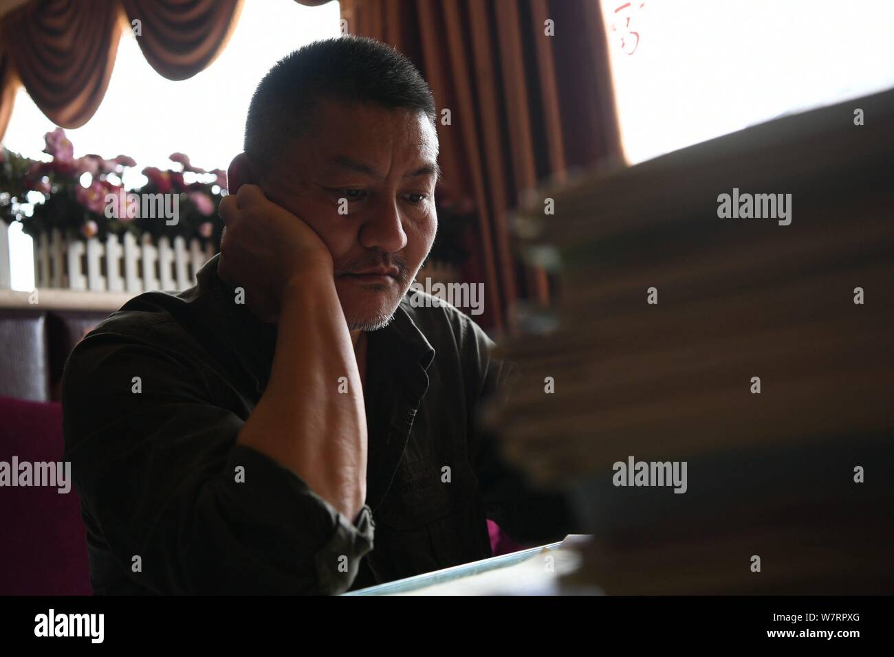 50-year-old Chinese man Liang Shi is pictured as he prepares for the ...
