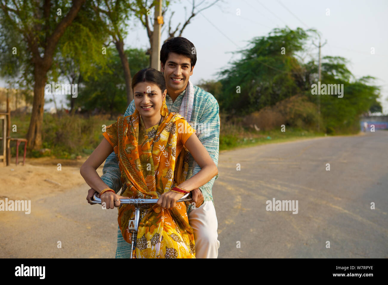 Riding bicycle on rural road hi-res stock photography and images - Alamy