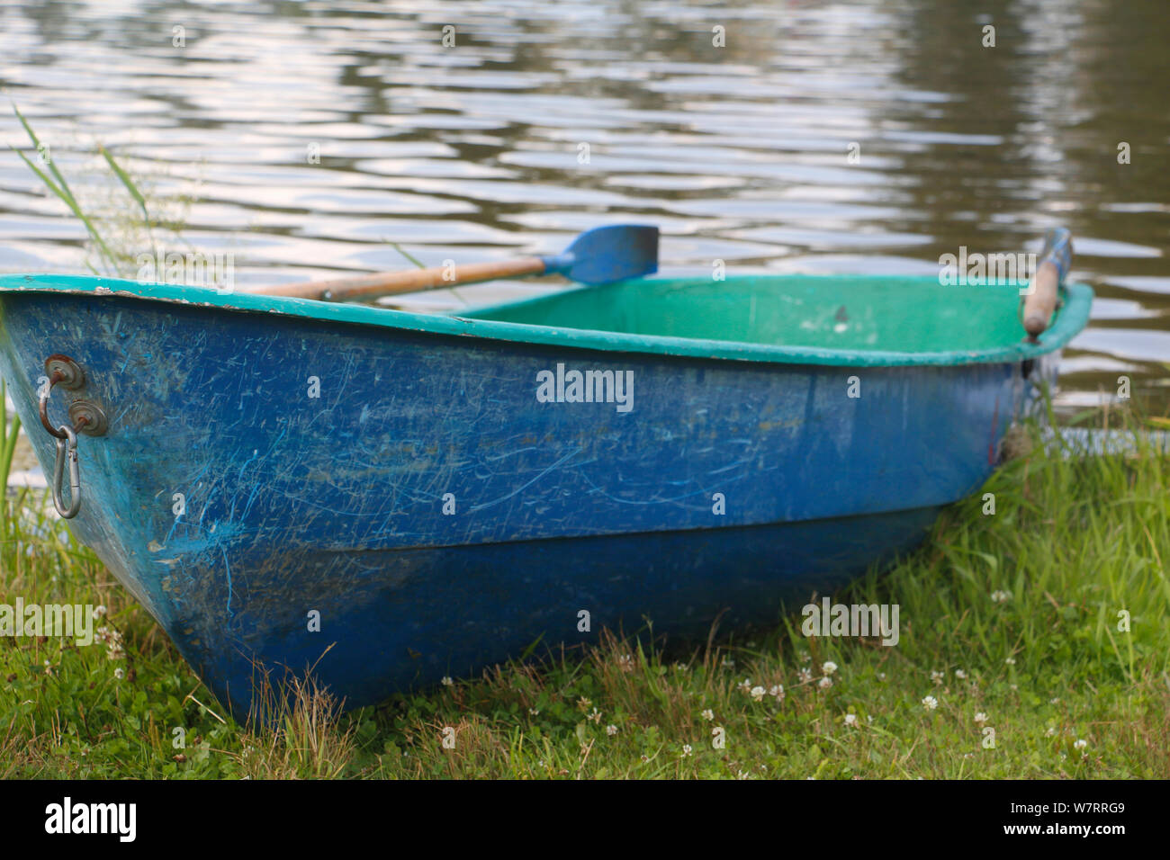 One boat on the lake. Empty fishing boat. Boat for riding tourists. Old ...