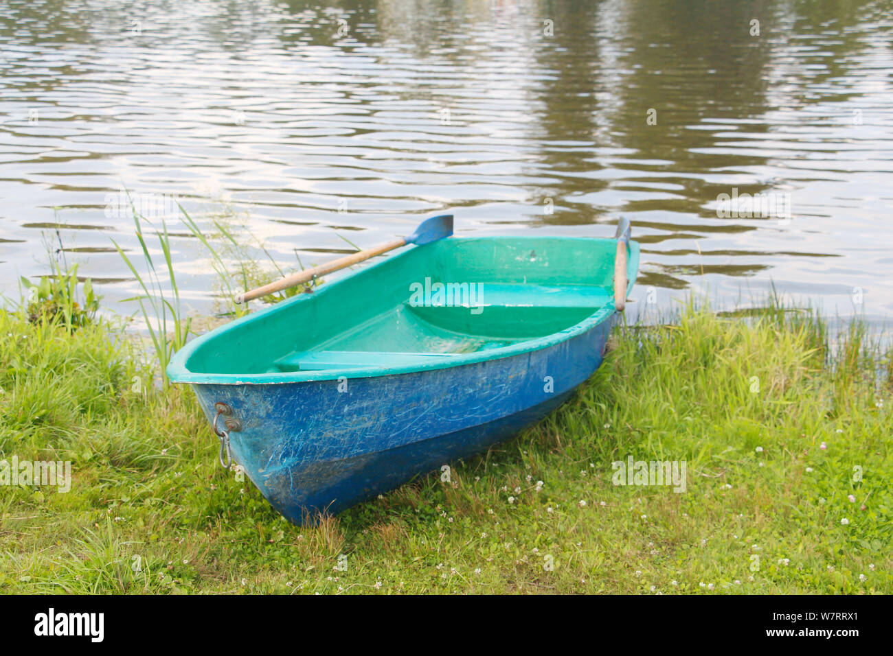 One boat on the lake. Empty fishing boat. Boat for riding tourists. Old ...
