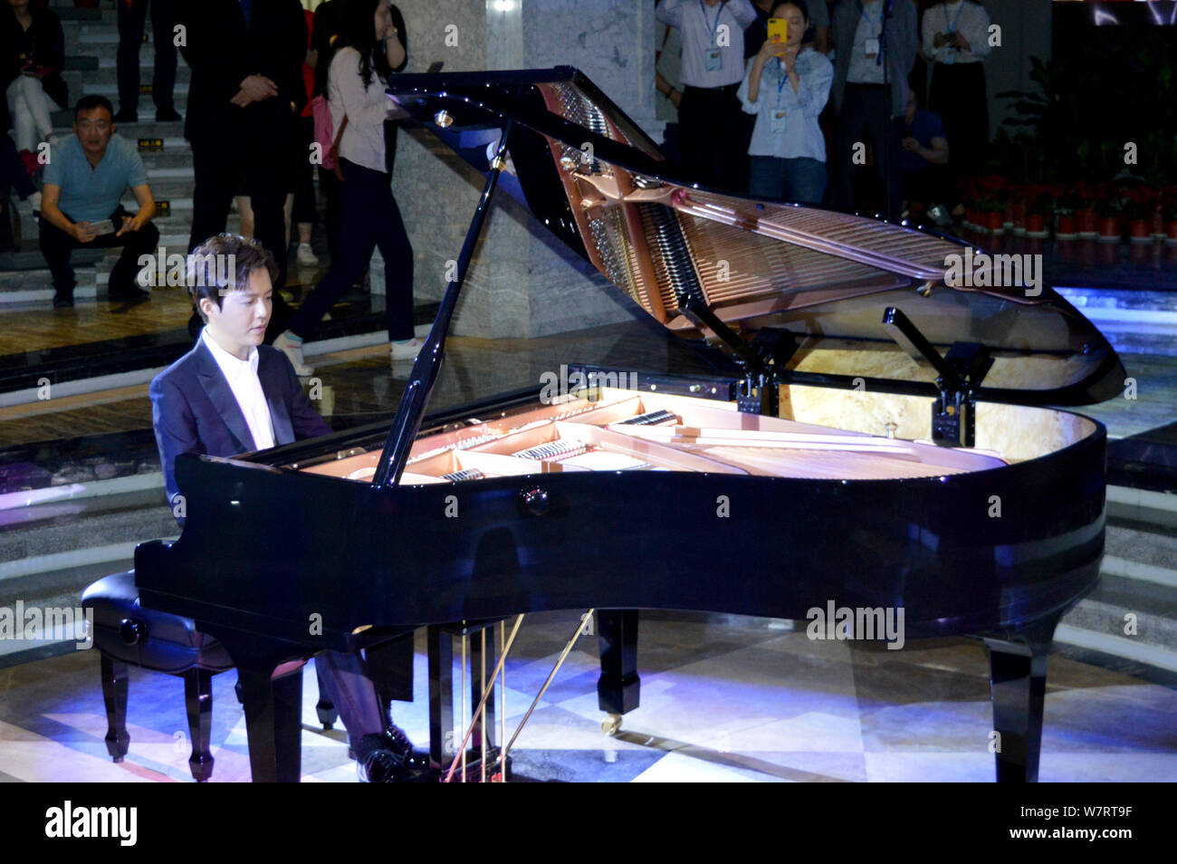 Chinese pianist Li Yundi performs during the opening ceremony for his ...