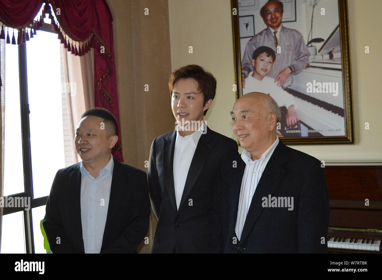 Chinese pianist Li Yundi, center, poses during the opening ceremony for ...