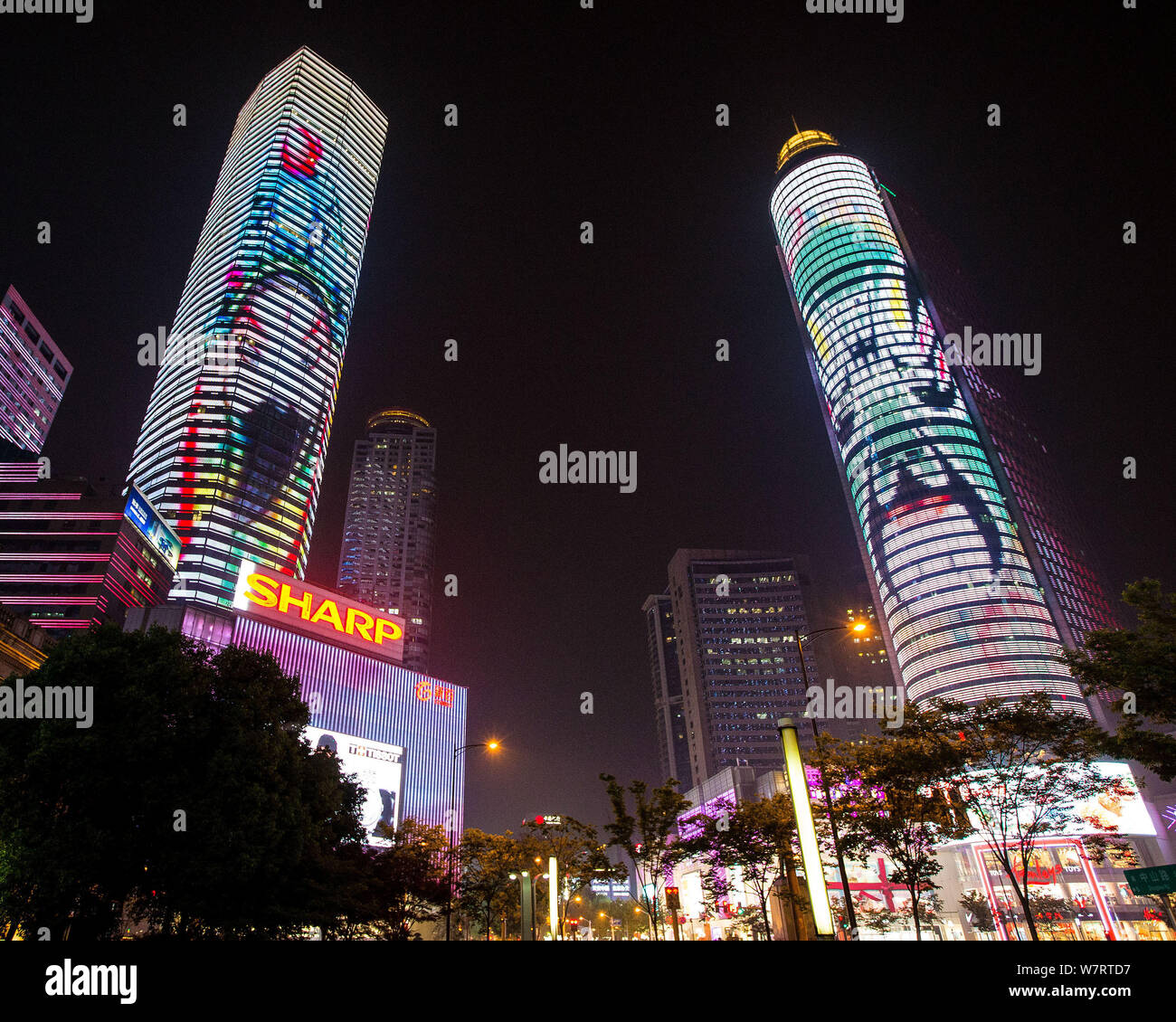 High-rise buildings are illuminated with lights to welcome the upcoming ...