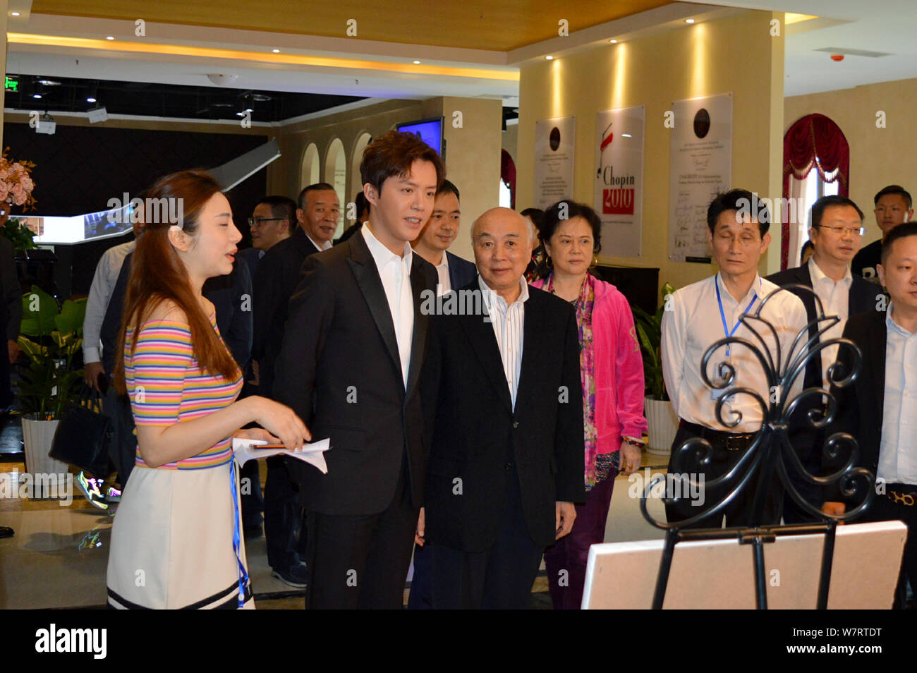 Chinese pianist Li Yundi, front center, poses during the opening ...