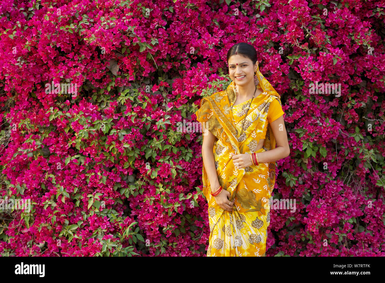 Smiling young woman in sari hi-res stock photography and images - Alamy