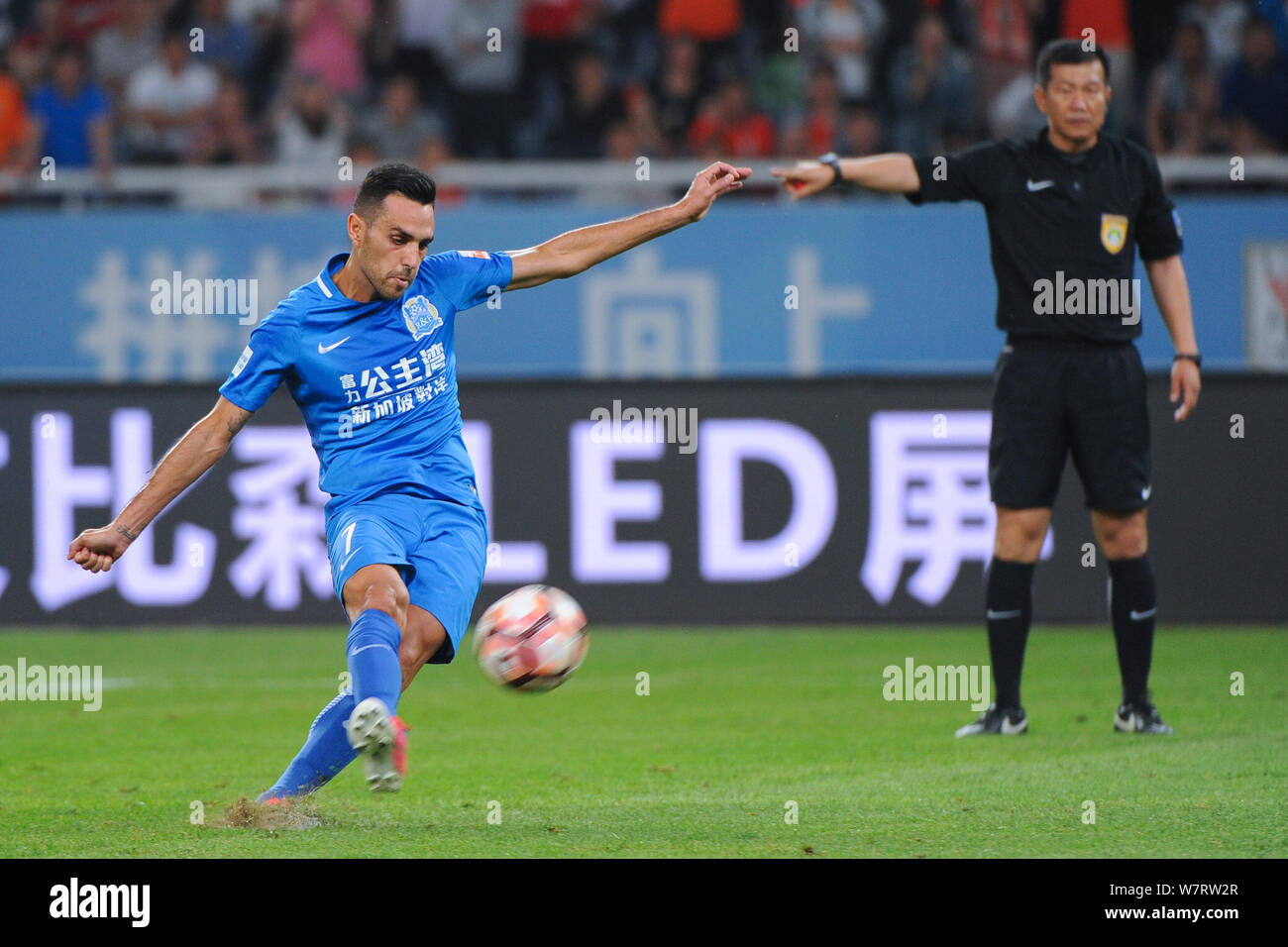 Israeli football player Eran Zahavi of Guangzhou R&F kicks the ball to ...