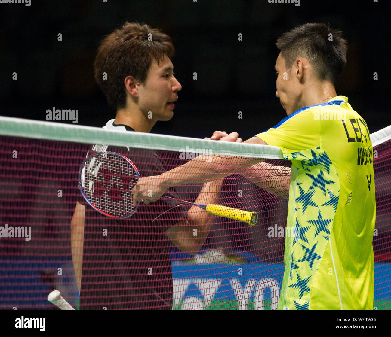 Lee Chong Wei of Malaysia, right, interacts with Yu Igarashi of Japan ...