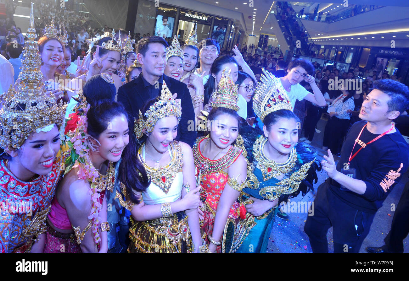 Thai actor Nawat Kulrattanarak, center, better known by his stage name ...
