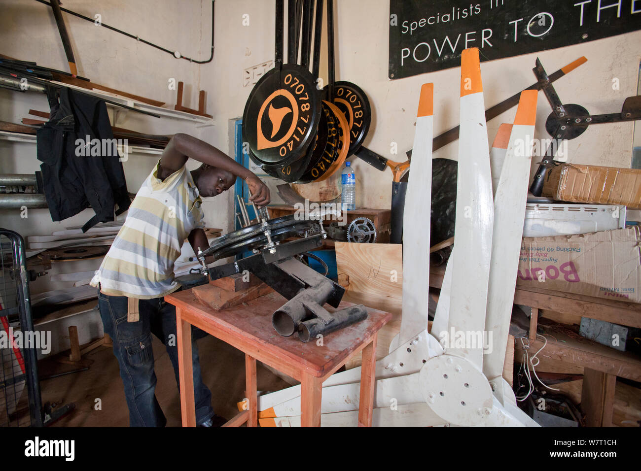 Wind power technician constructing a turbine, Kisumu Region, Kenya ...