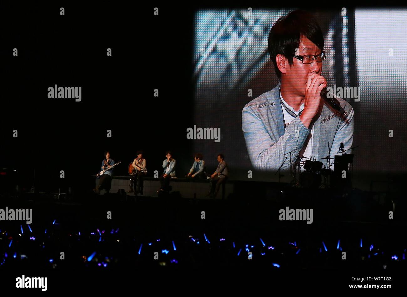 Liu Yen-ming, better known by his stage name Guan You/Ming, center, and ...