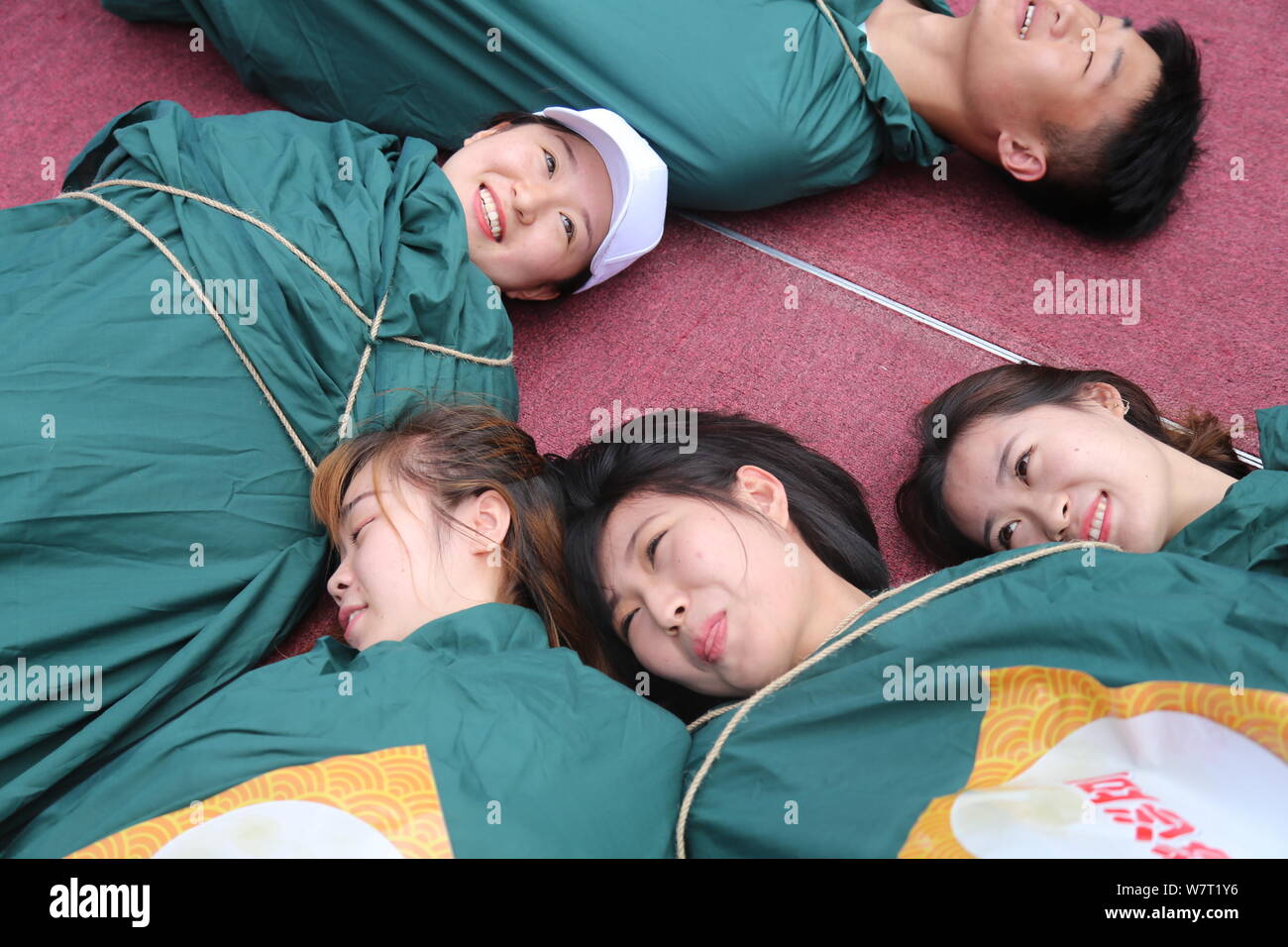 University students wrapped up as zongzi or glutinous rice dumplings ...